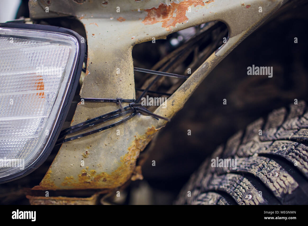 Old and rusty car's suspension, which removes the wheels for repair ...