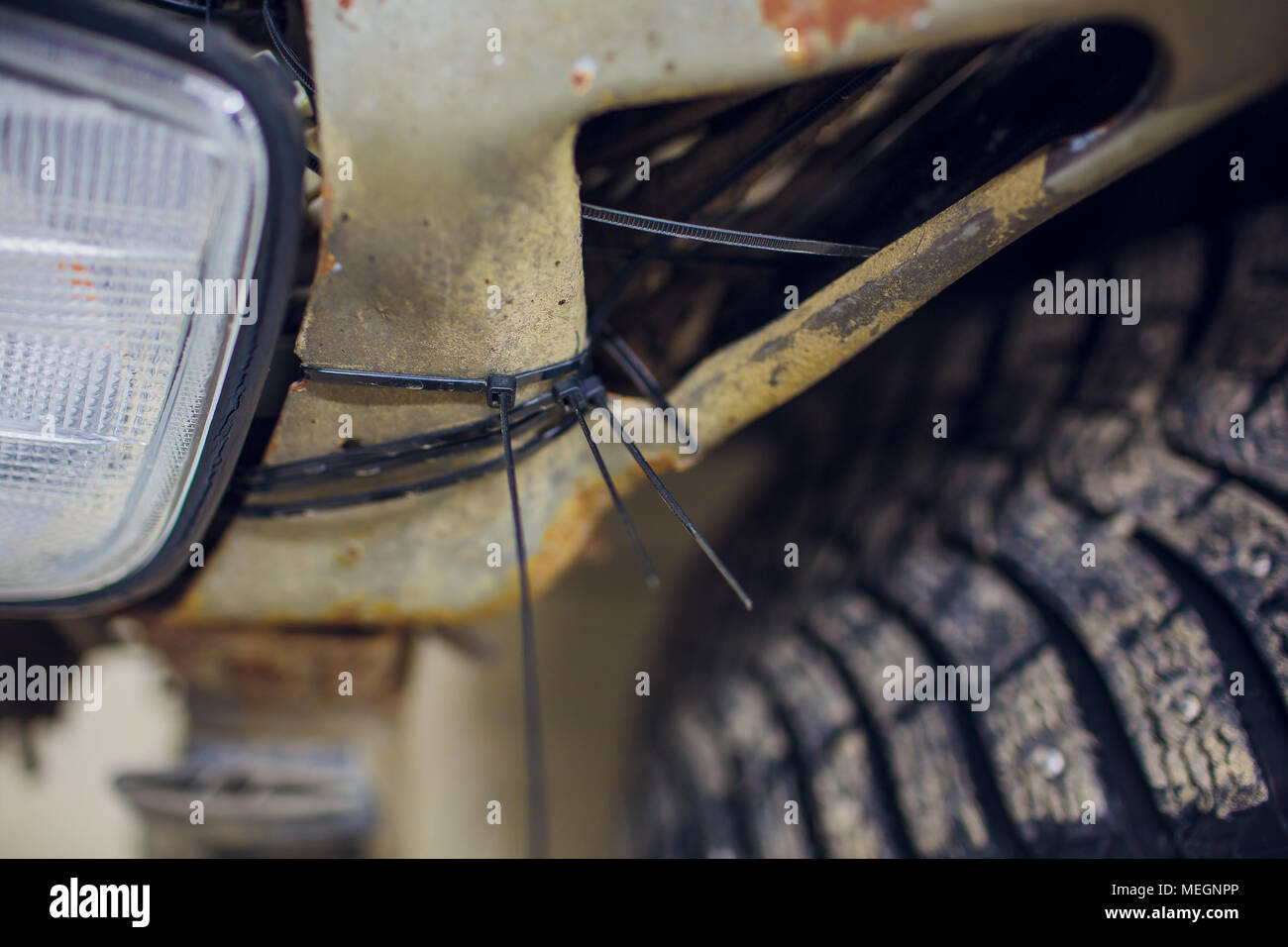 Old and rusty car's suspension, which removes the wheels for repair ...