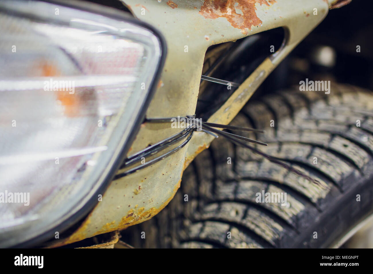 Old and rusty car's suspension, which removes the wheels for repair ...
