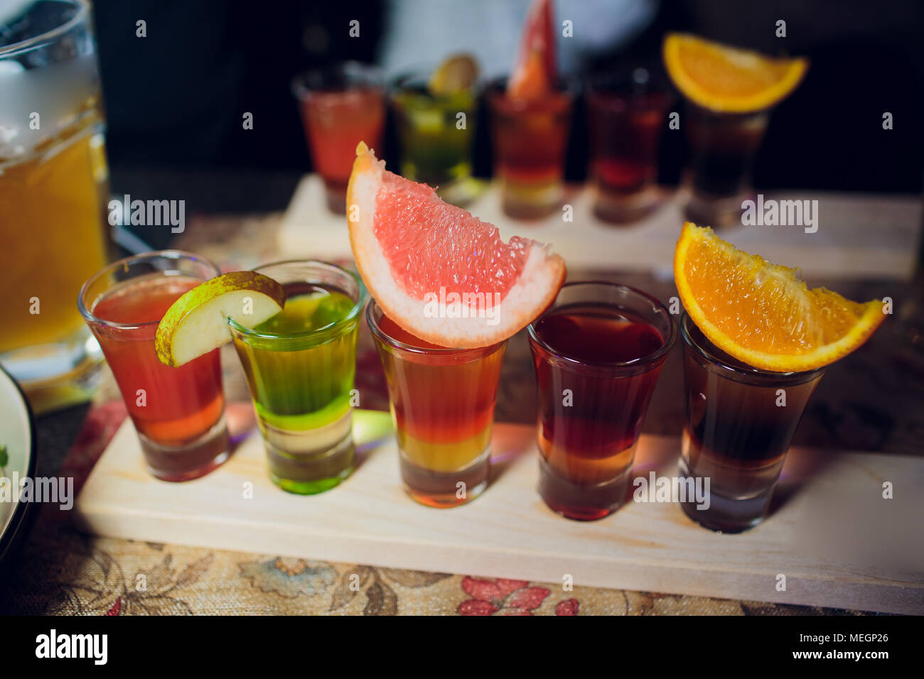 Glasses of cocktails on bar background color drink Stock Photo - Alamy