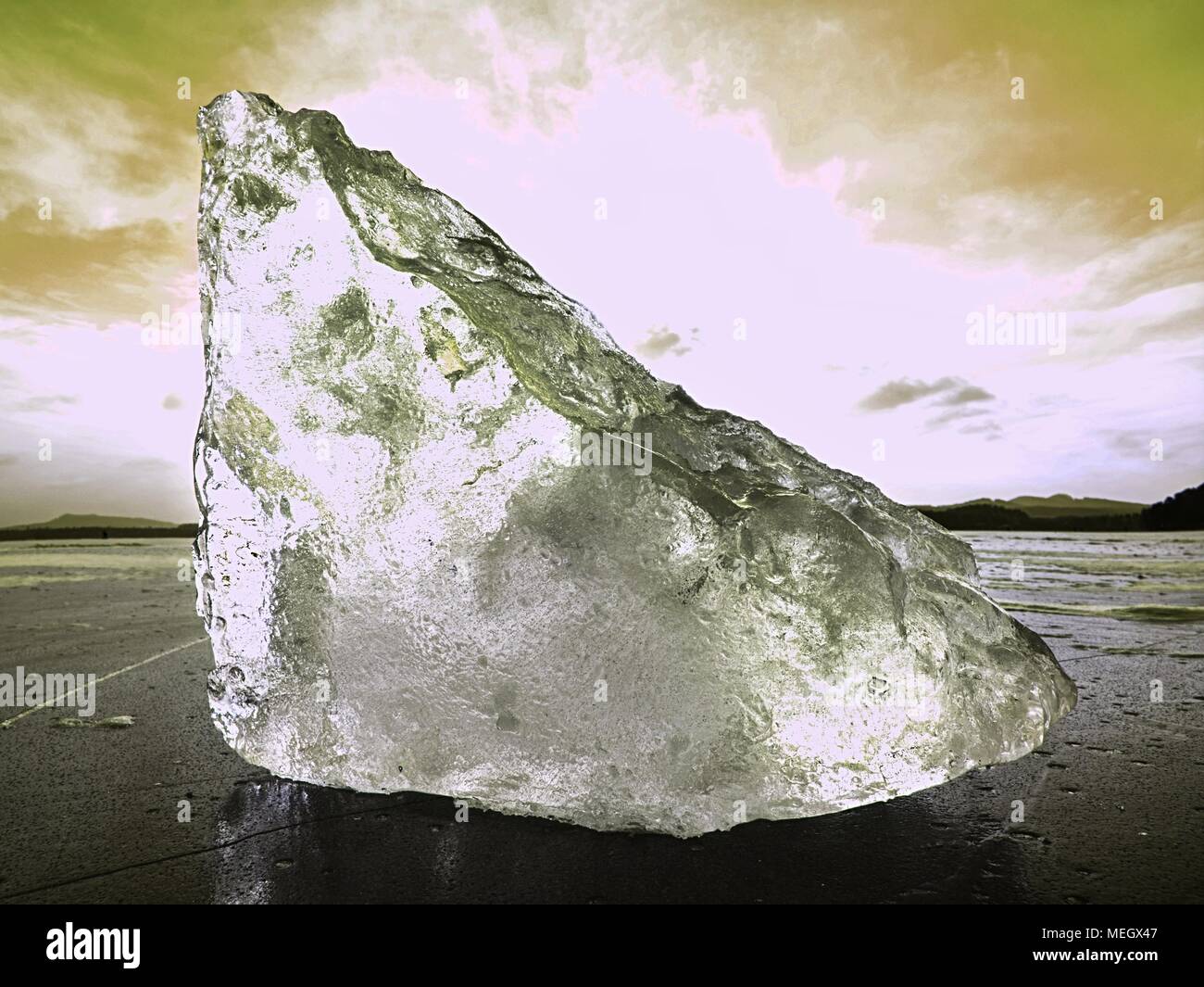 Beautiful epic ice crystal in the frozen bay. Sun rays reflection in ...