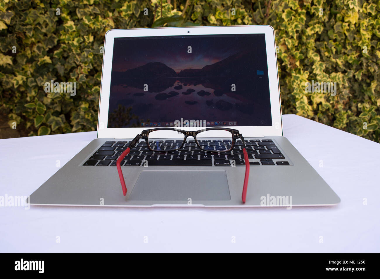 Computer and eyeglasses Stock Photo - Alamy