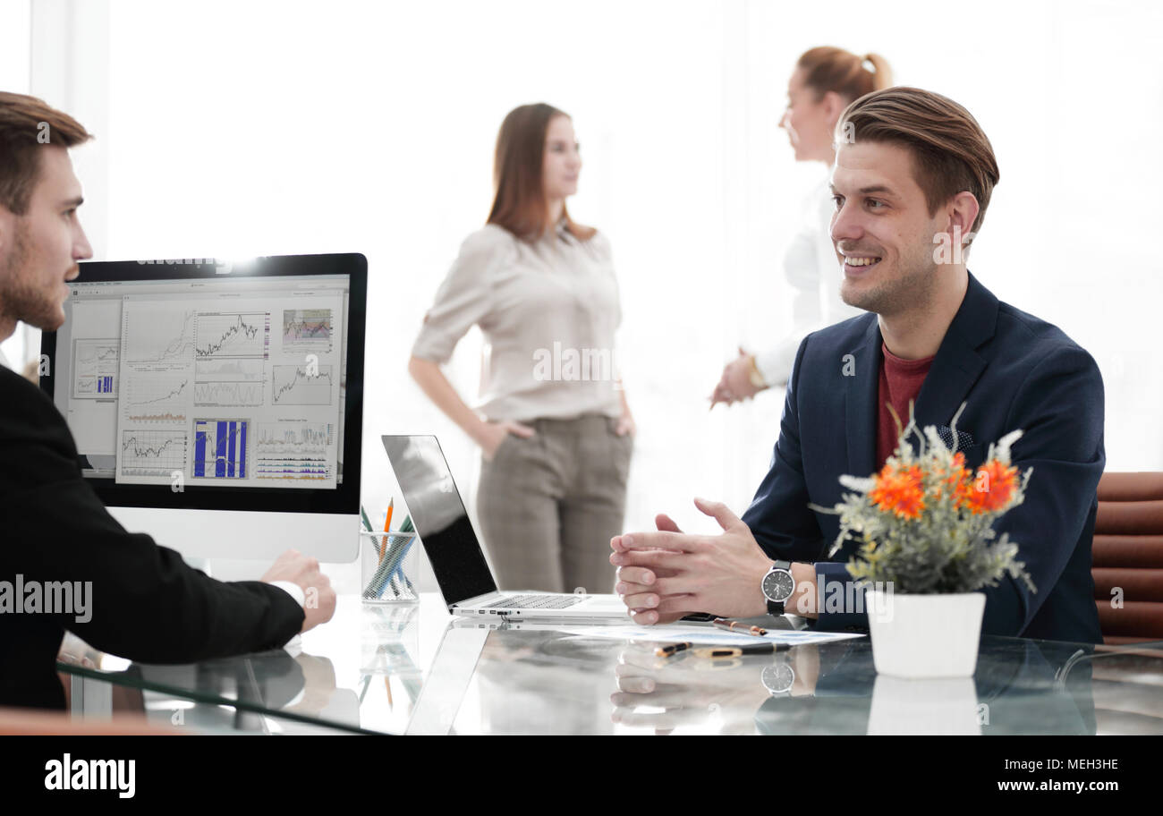 senior and junior businessman discuss something during their meeting ...
