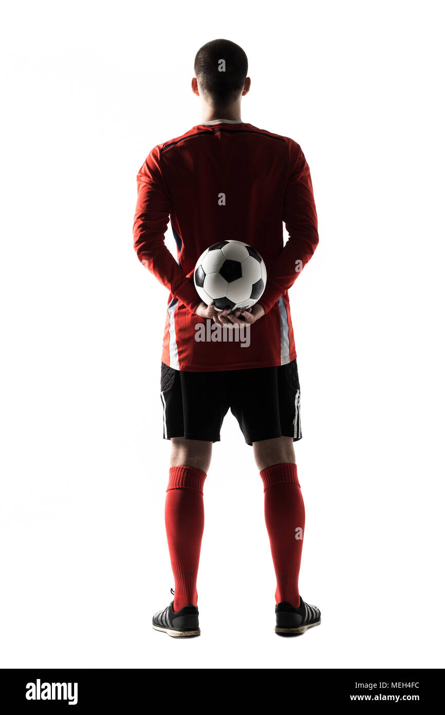 Rear view of silhouette of young football player isolated on white ...