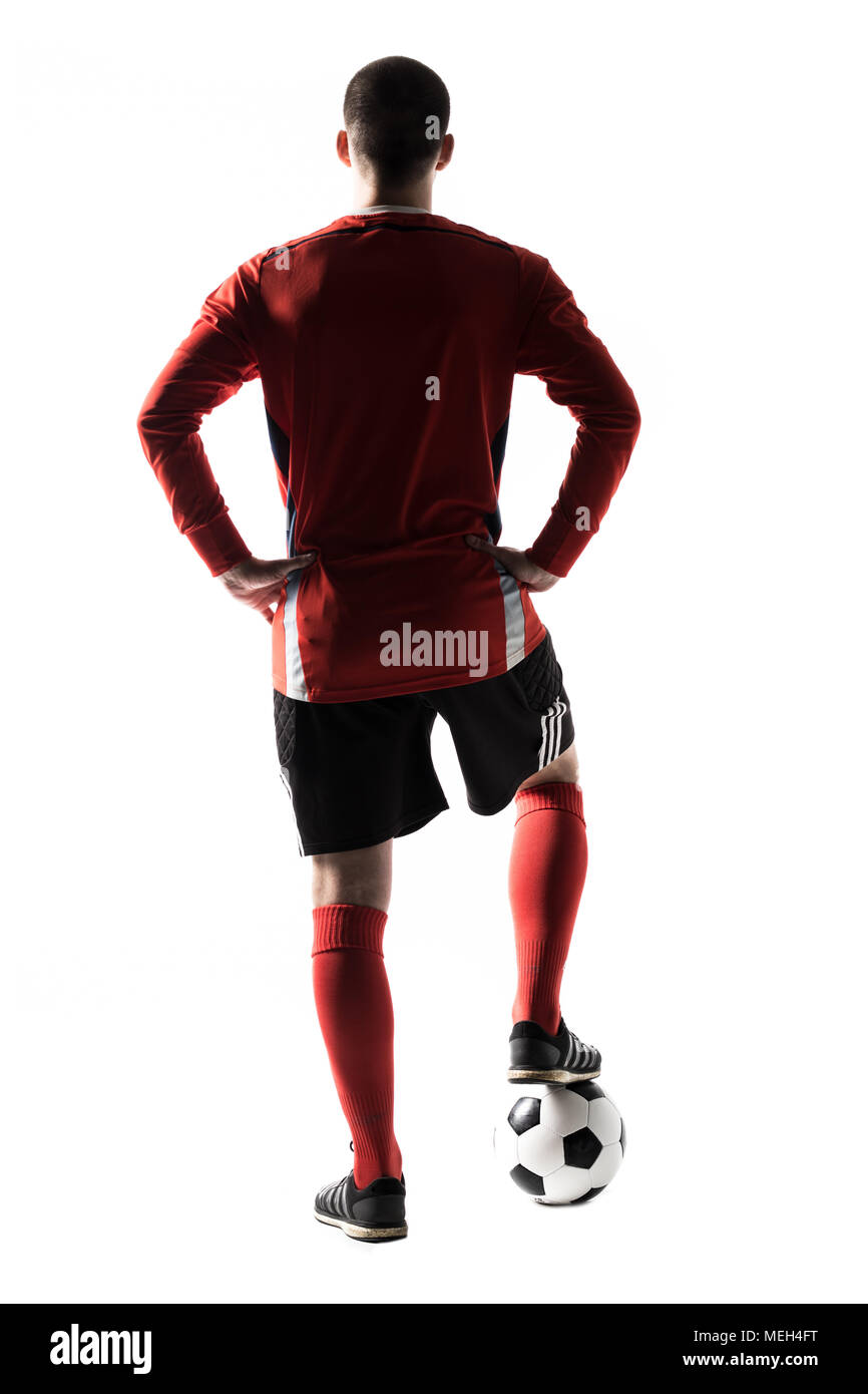 Rear view of silhouette of young football player isolated on white ...