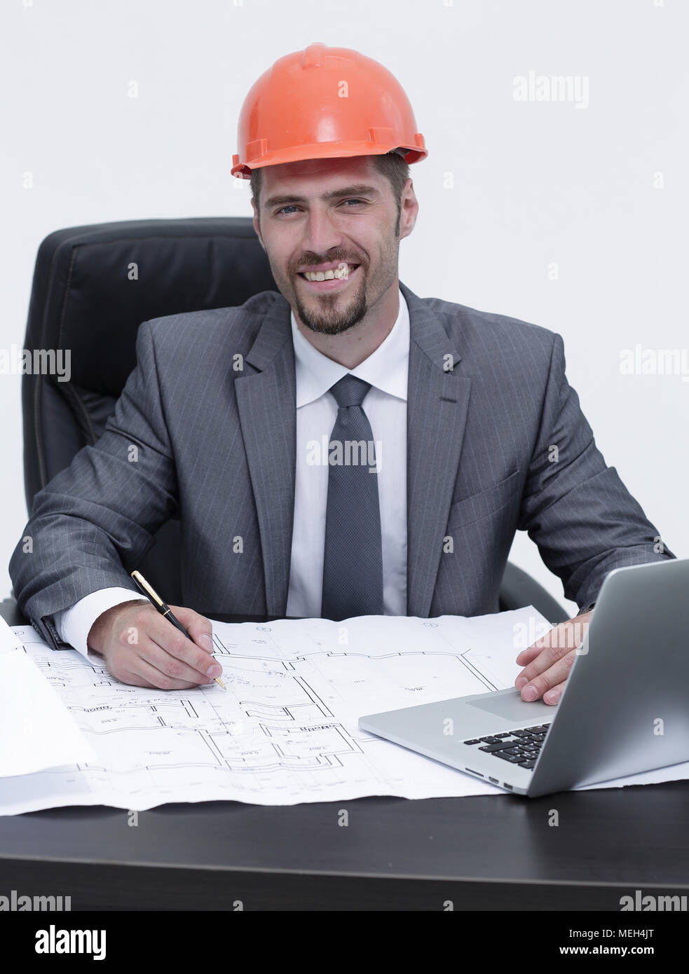 engineer is studying the draft,sitting behind a Desk Stock Photo - Alamy