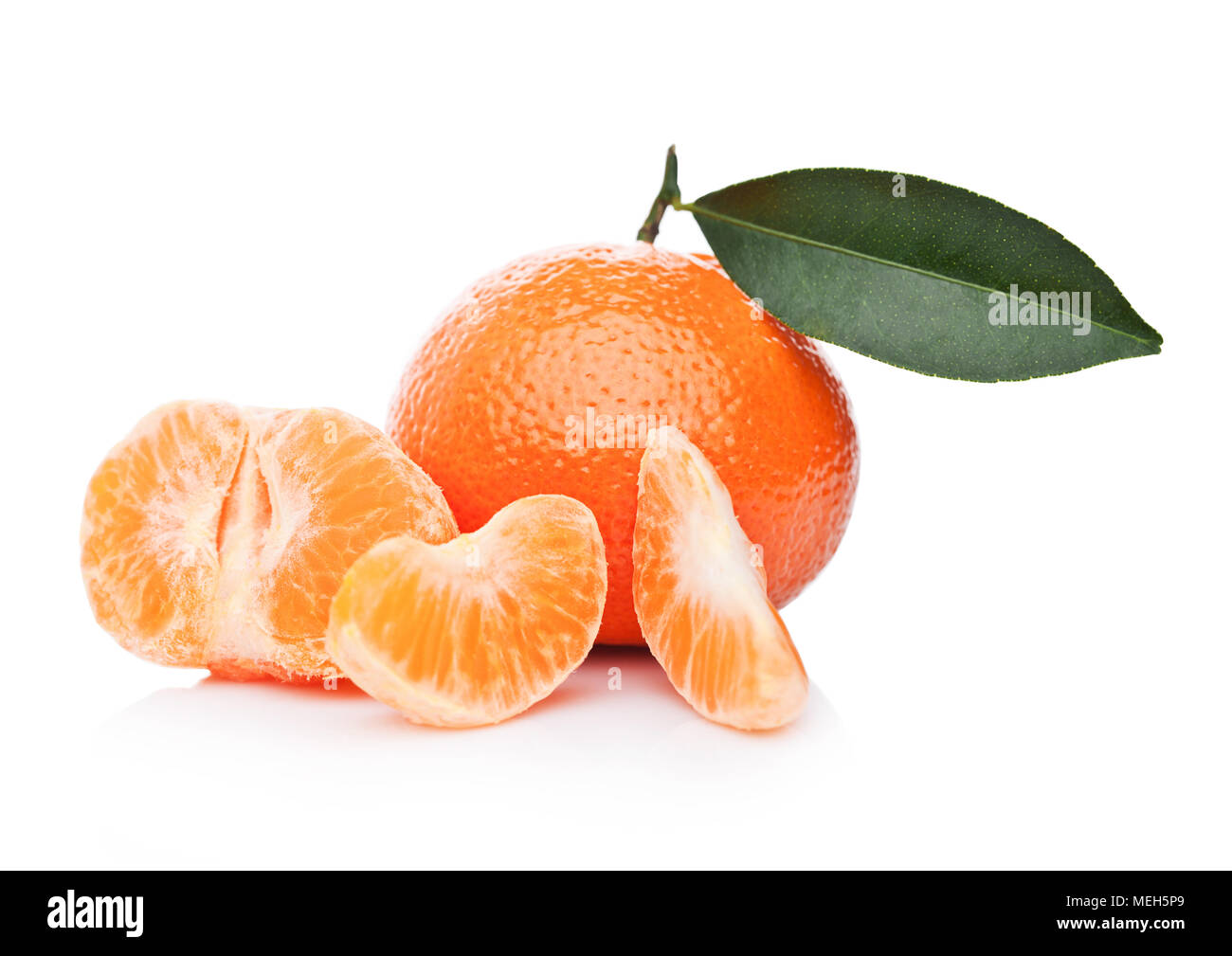 Fresh organic mandarins tangerines fruits with leaves with peeled ...