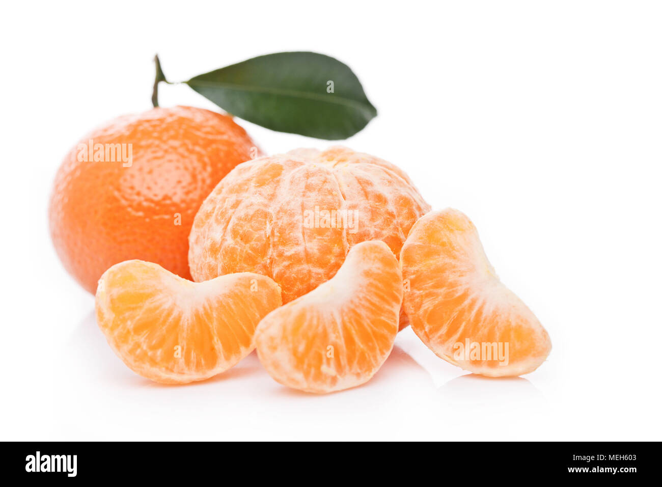 Fresh organic mandarins tangerines fruits with leaves with peeled ...