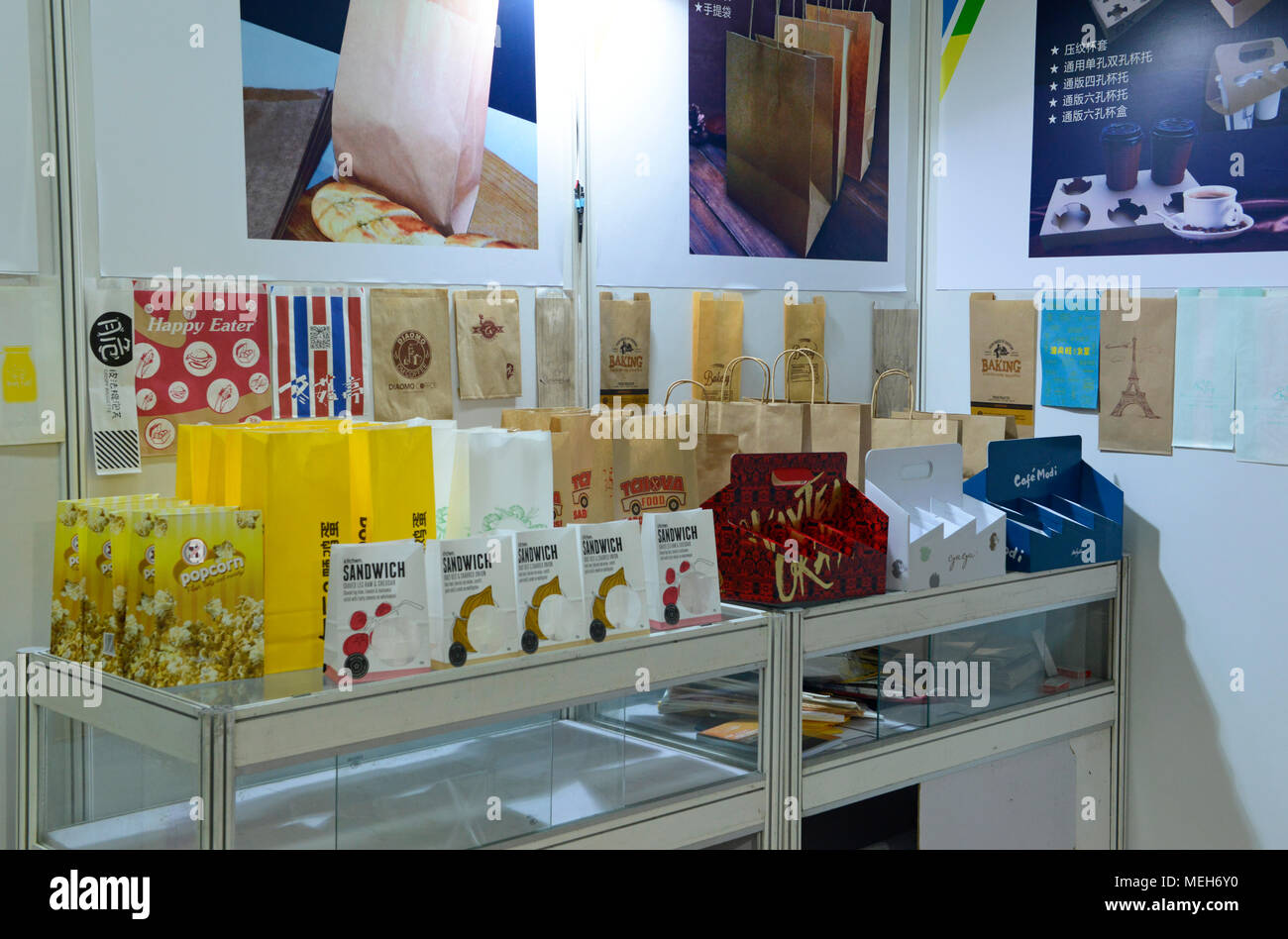 Paper bags and boxes for cakes and pastries on display at the China ...