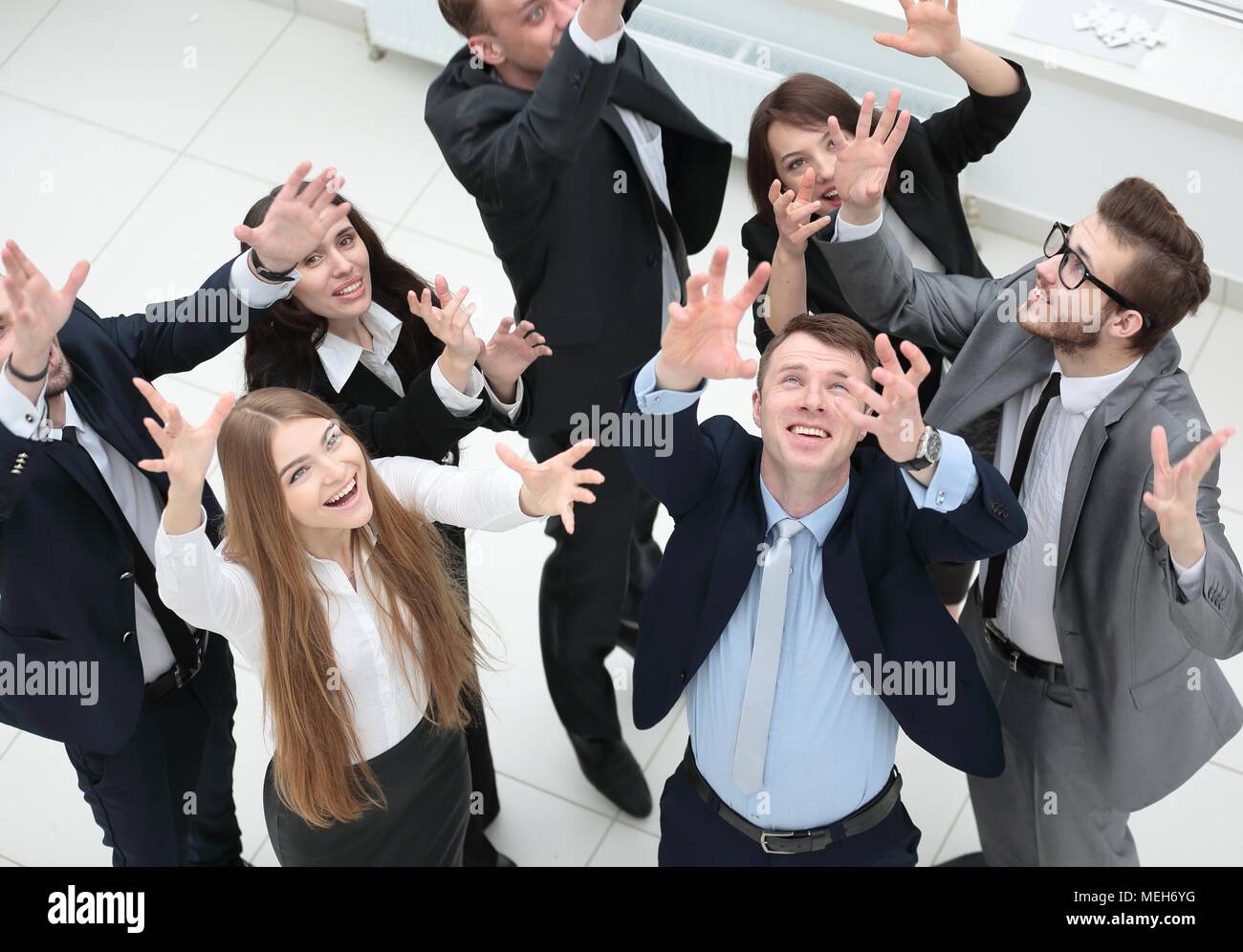 view from the top. joyful business team hands up Stock Photo - Alamy