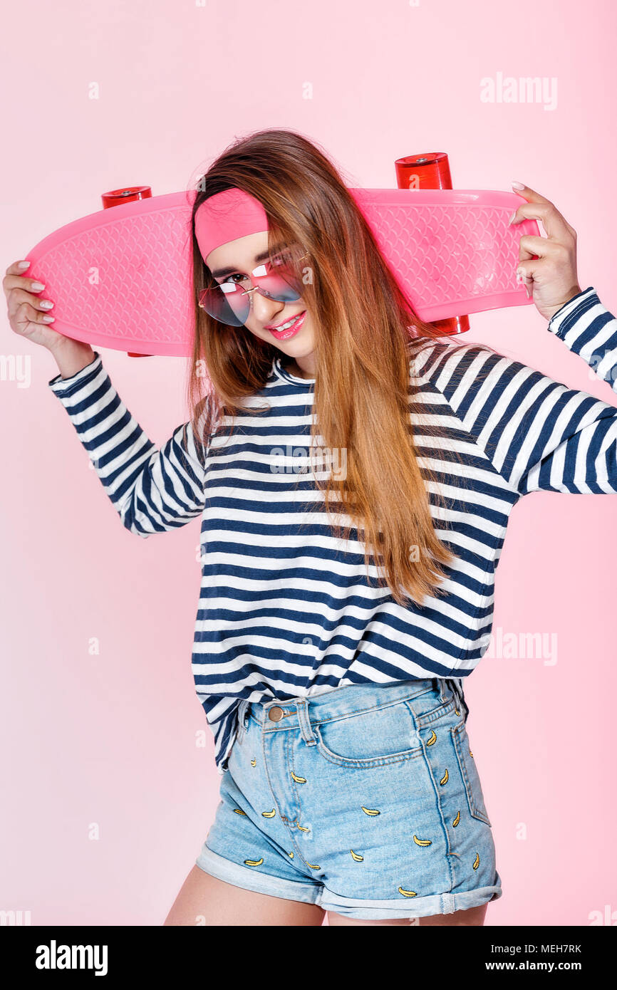 beautiful woman with skate in studio Stock Photo - Alamy