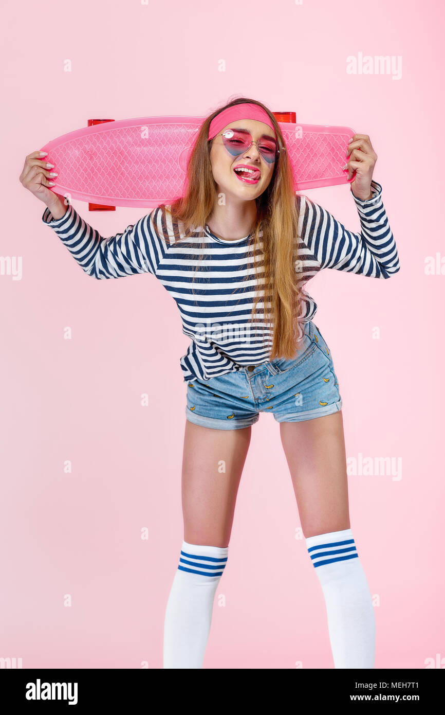 beautiful woman with skate in studio Stock Photo - Alamy