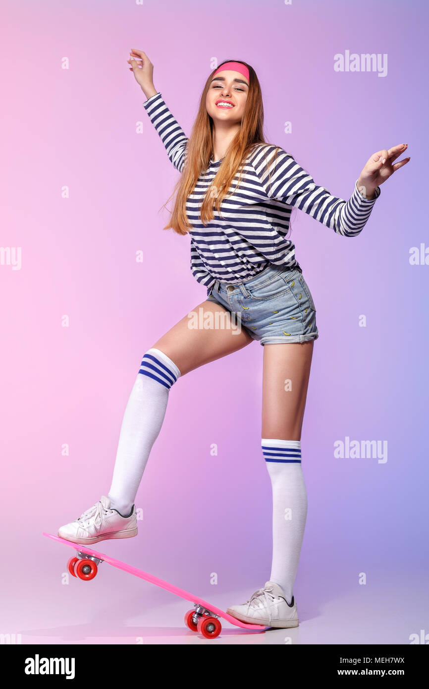 beautiful woman with skate in studio Stock Photo - Alamy