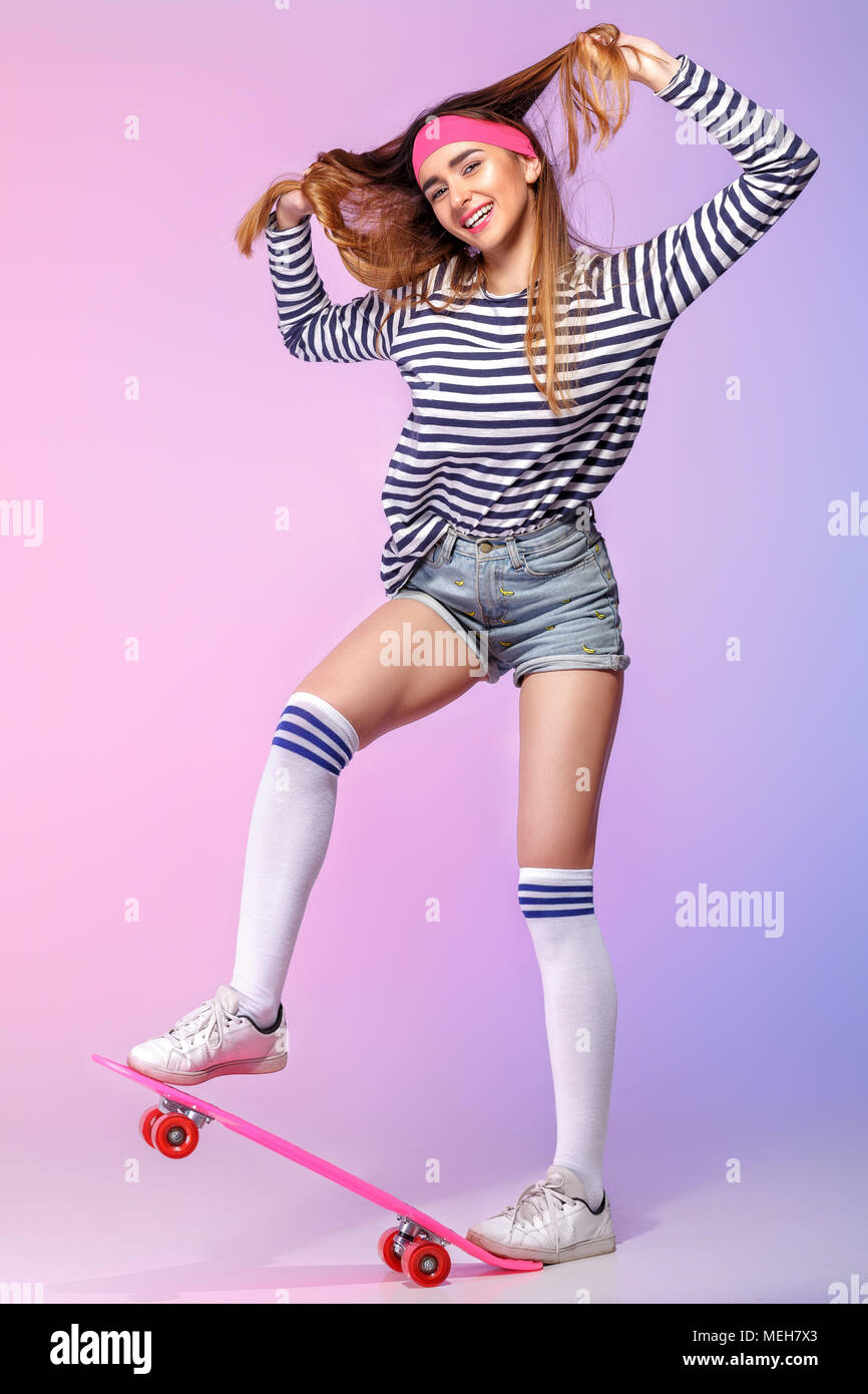 beautiful woman with skate in studio Stock Photo - Alamy