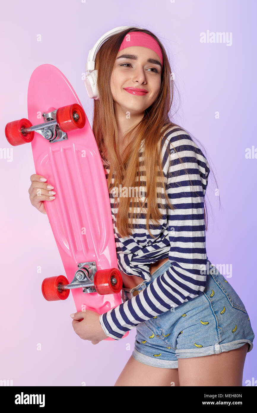 beautiful woman with skate in studio Stock Photo - Alamy