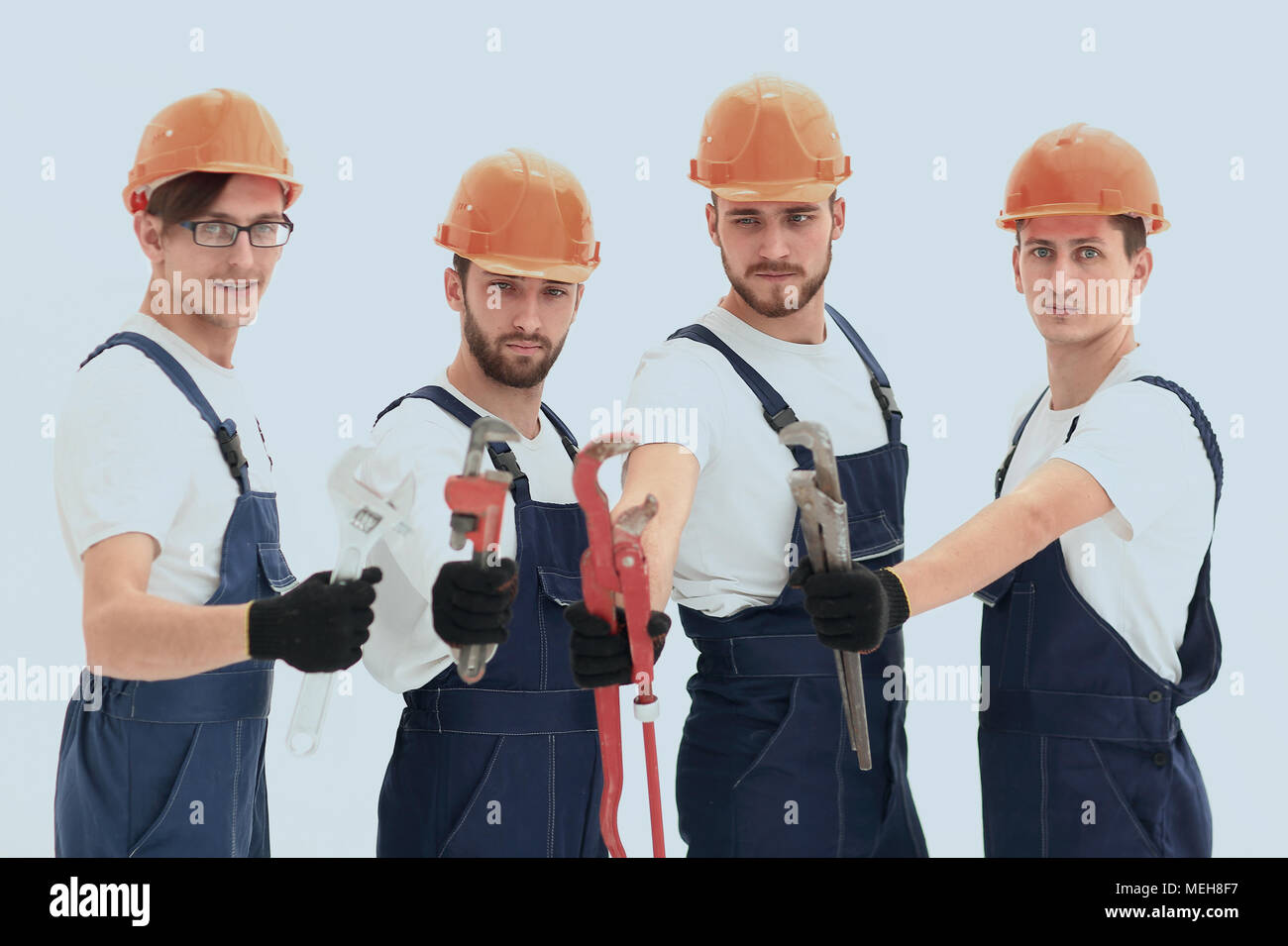 group of plumbers with working tools Stock Photo - Alamy
