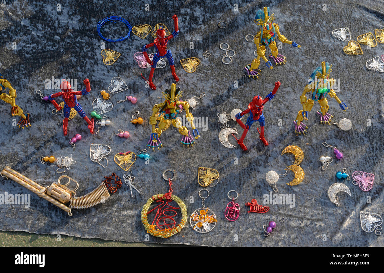 Handmade wire toy and model figurines for sale at a street market in ...