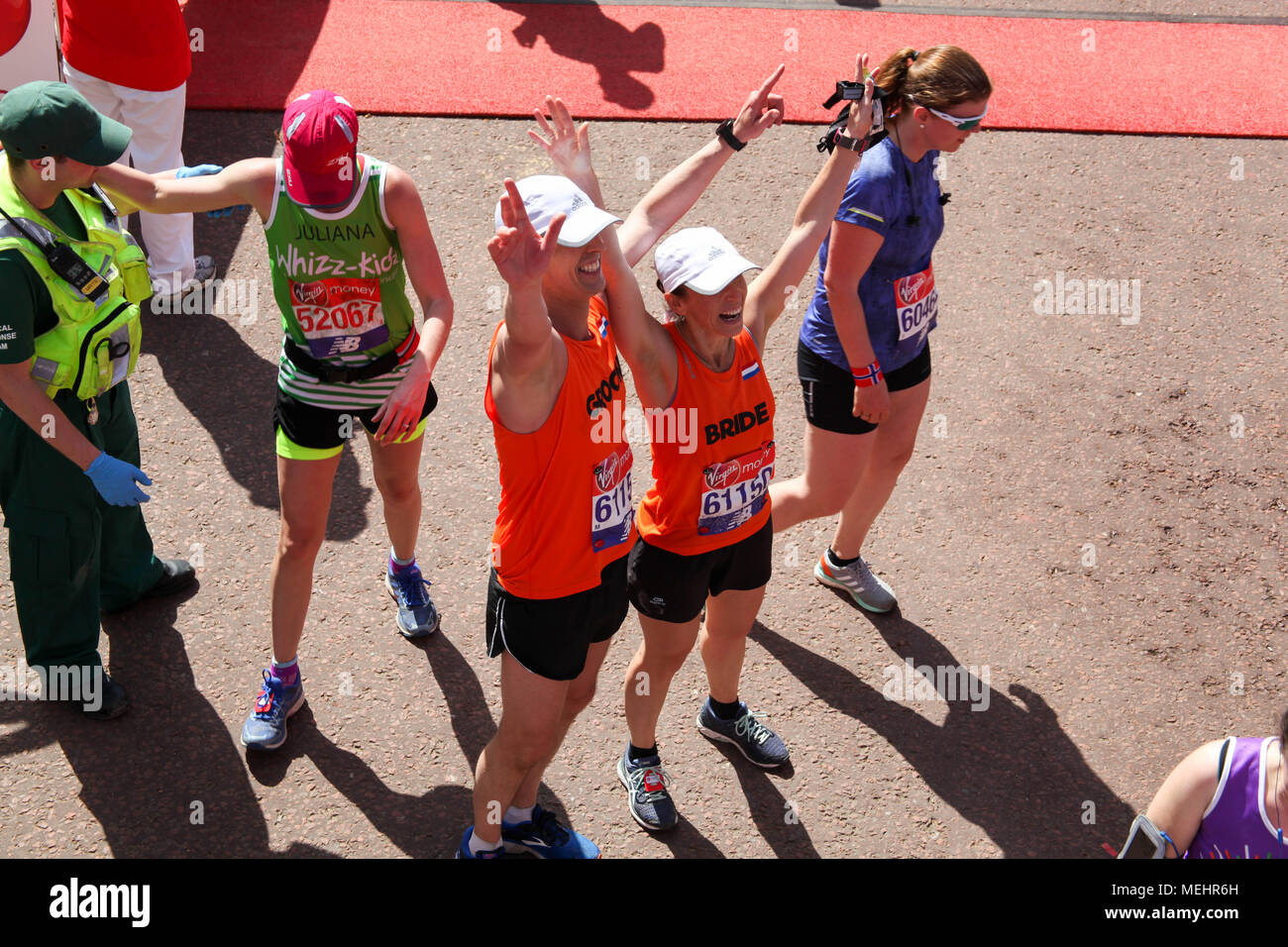 London, UK, 22 April 2018. Husband and Wife Runner's cross the finish ...