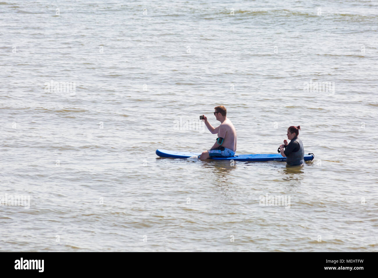 Sunbathing on paddle board hi-res stock photography and images - Alamy