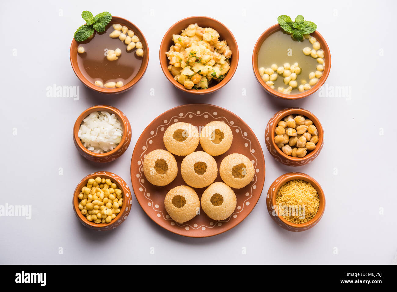 Pani Puri is Indian chat item served in a terracotta bowls and plate ...