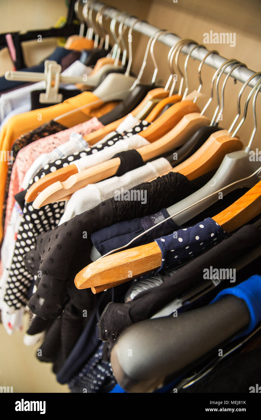 A line of clothes in the closet Stock Photo - Alamy