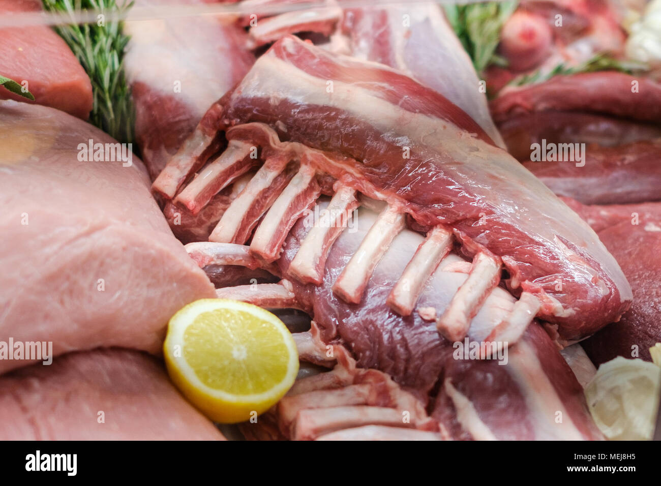 raw meat and ribs closeup at butcher shop - food market Stock Photo - Alamy