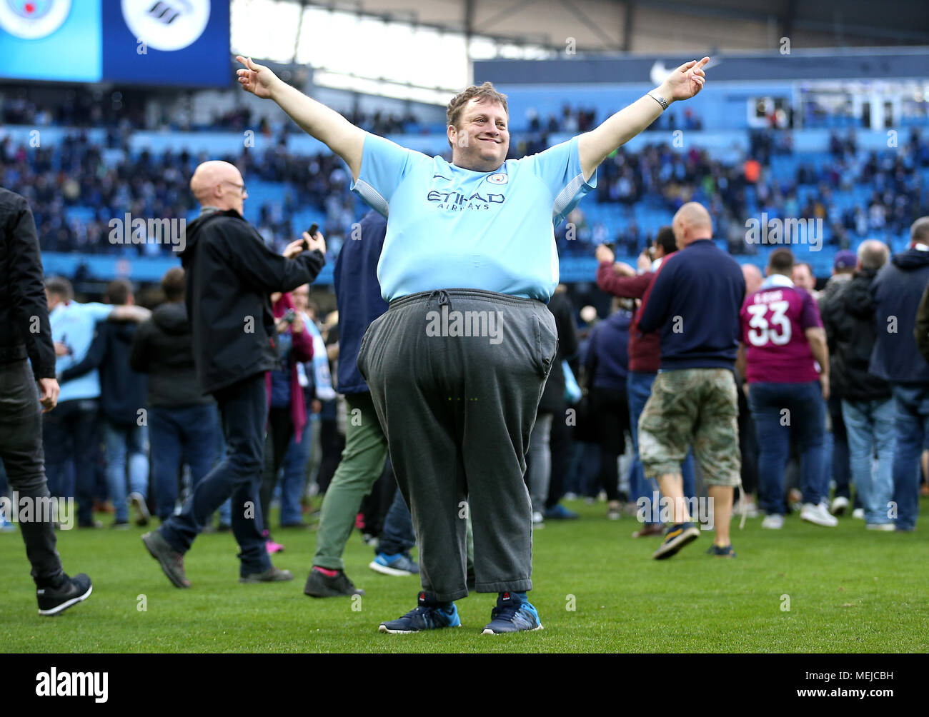 Fans invade the pitch after the final whistle during the Premier League ...