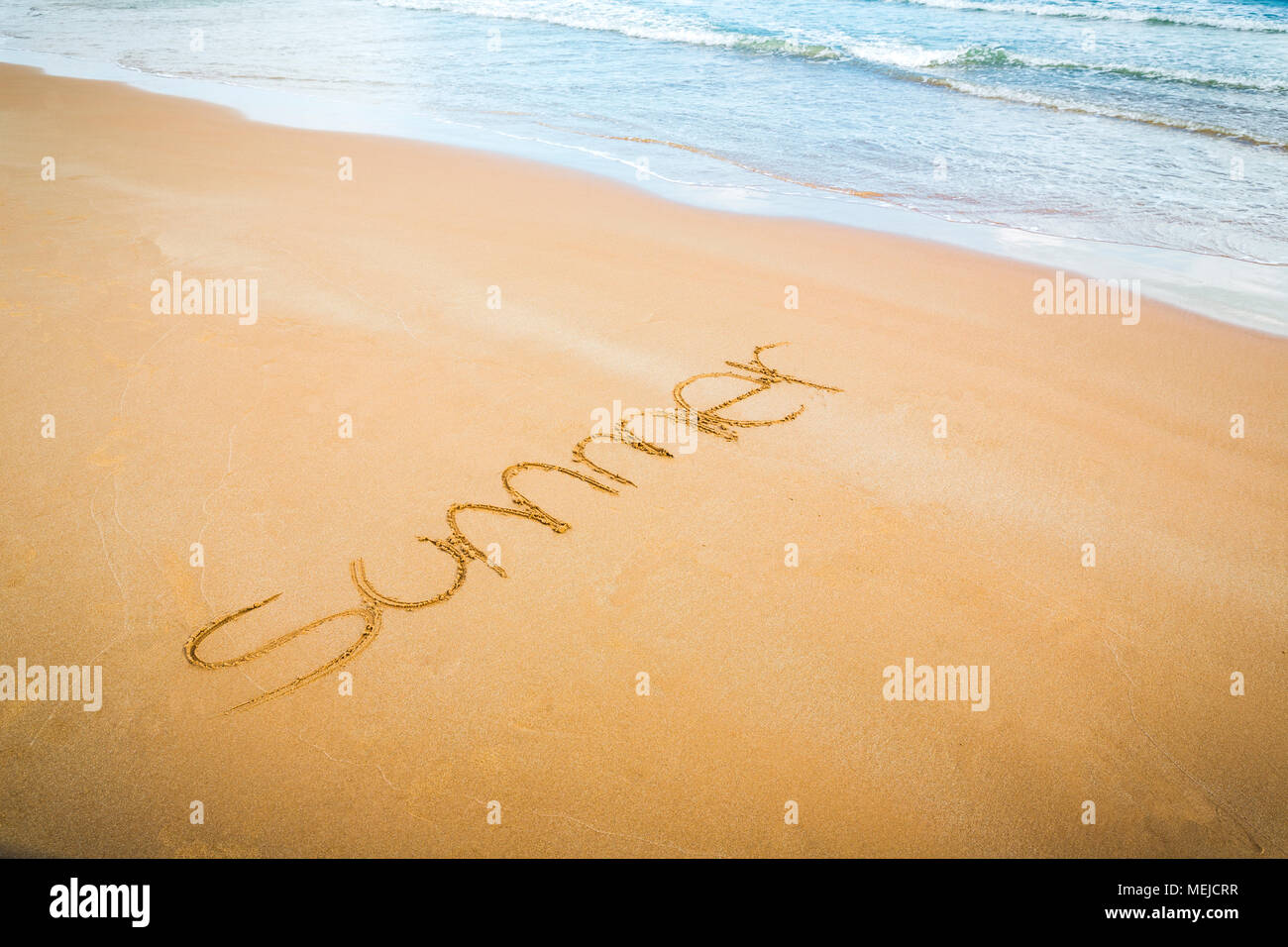 The word 'summer' hand-written on the beach Stock Photo - Alamy