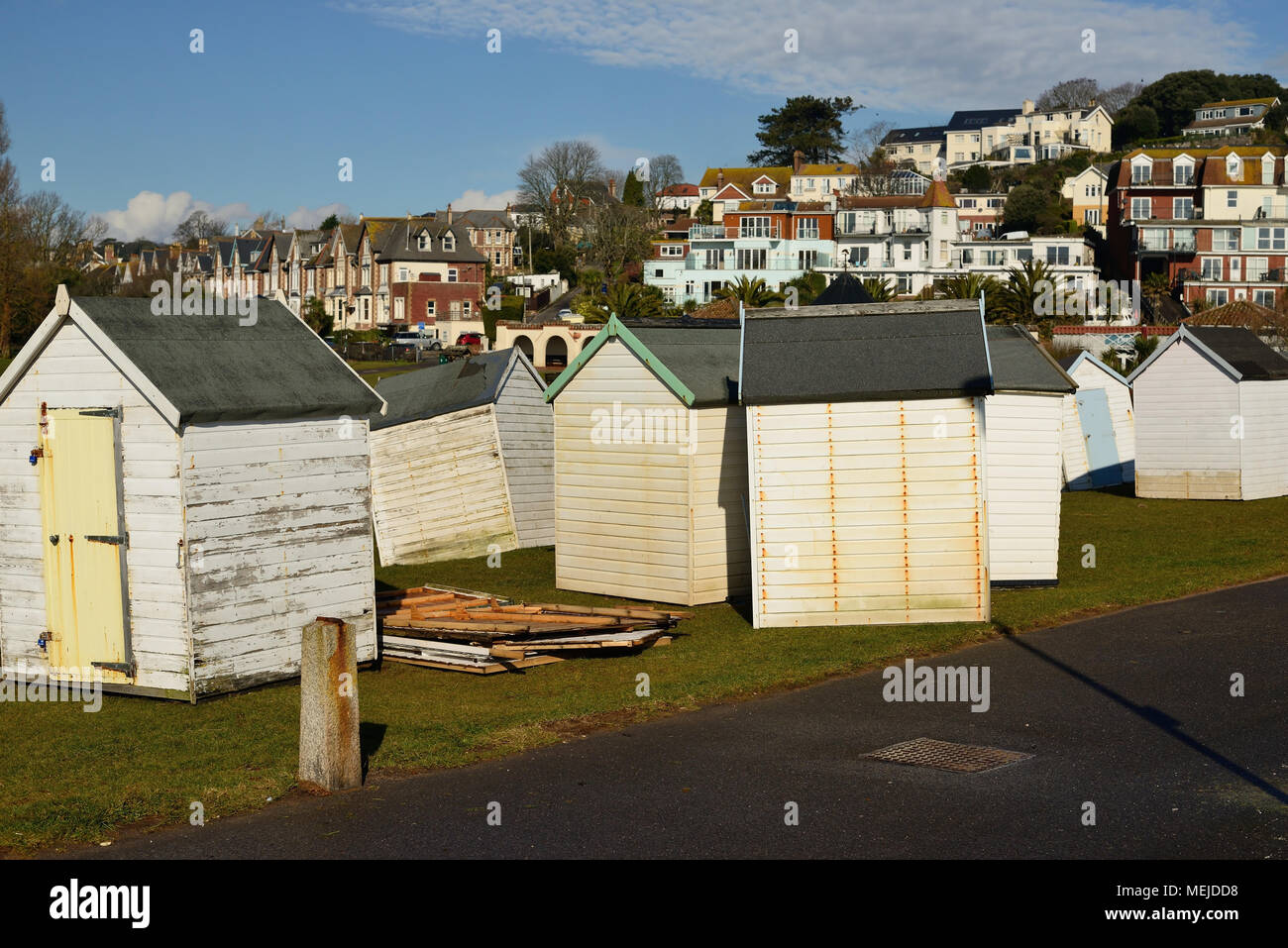 Beach huts displaced and damaged by stormy weather Stock Photo - Alamy