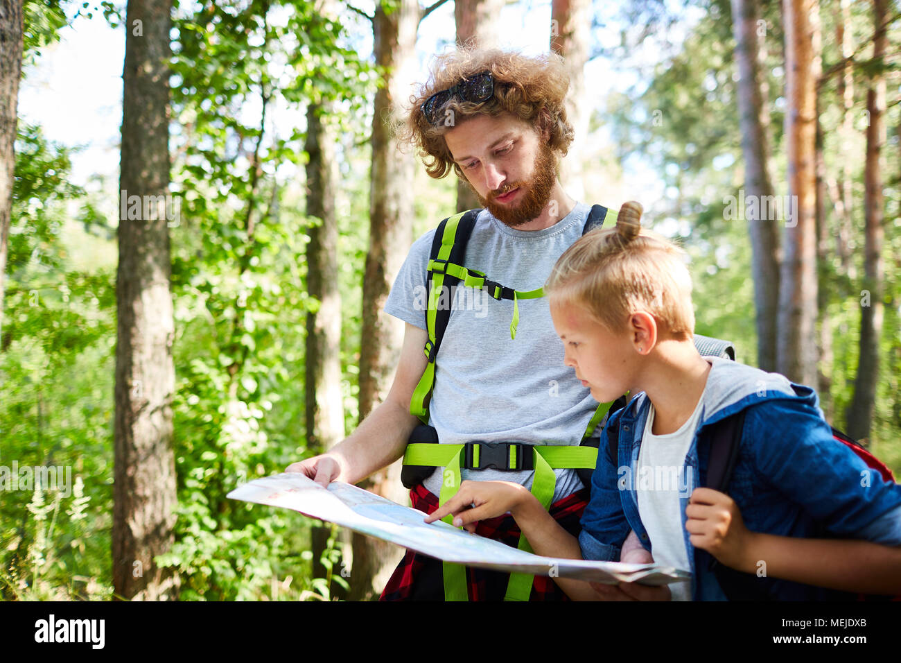 Scouts with map Stock Photo - Alamy