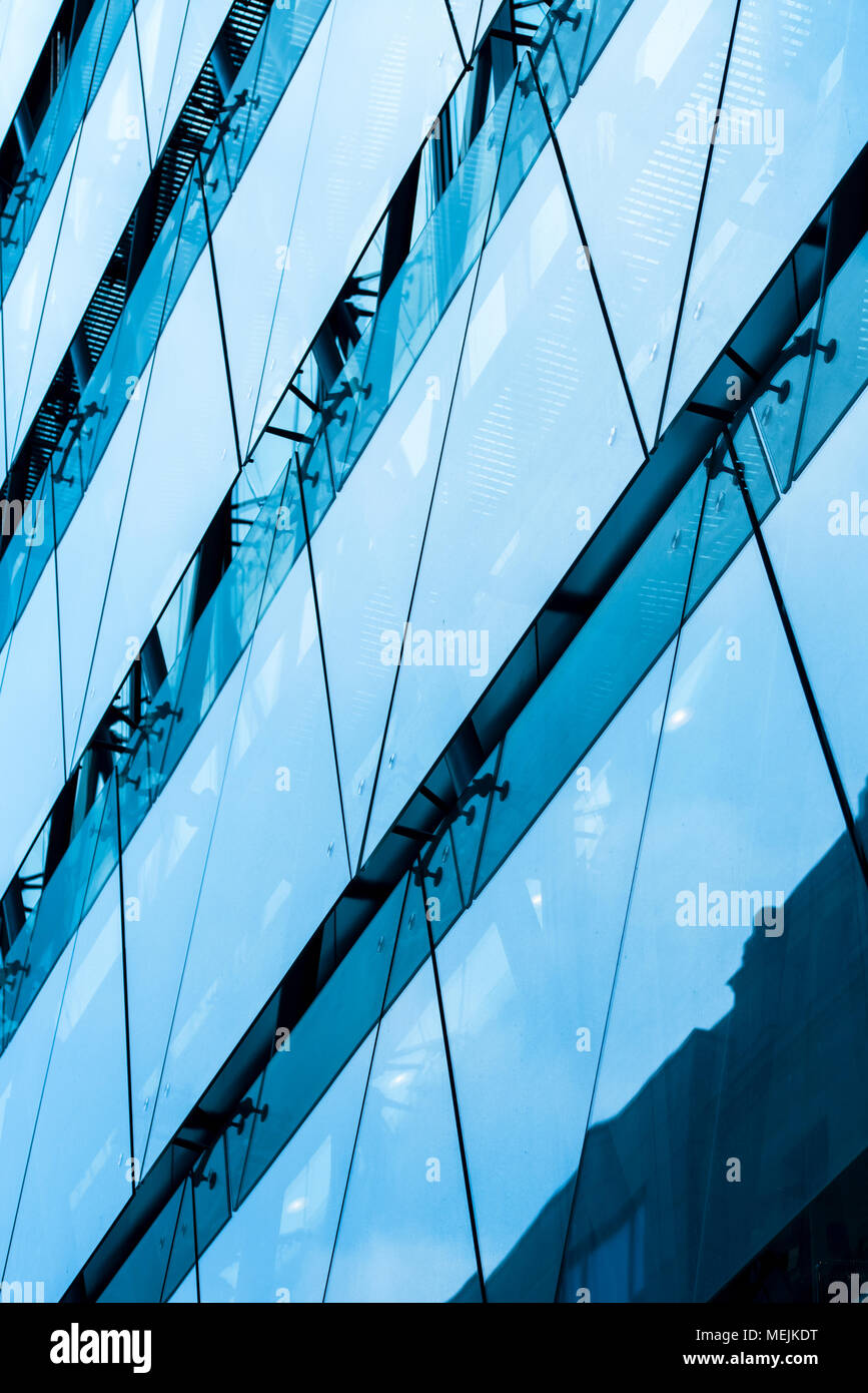 glass wall of a modern building with a reflection Stock Photo - Alamy