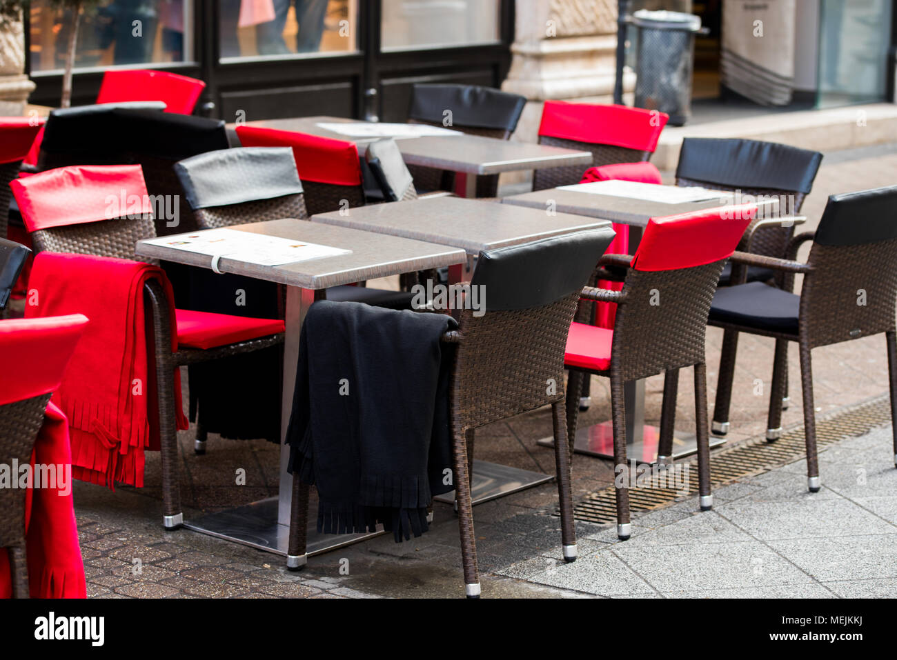 tables and chairs on the street Stock Photo - Alamy
