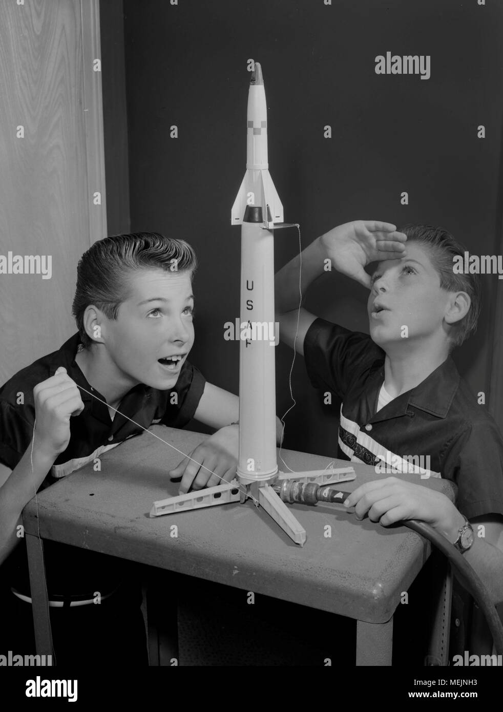 Two boys play with a lauchable rocket, ca. 1959 Stock Photo - Alamy