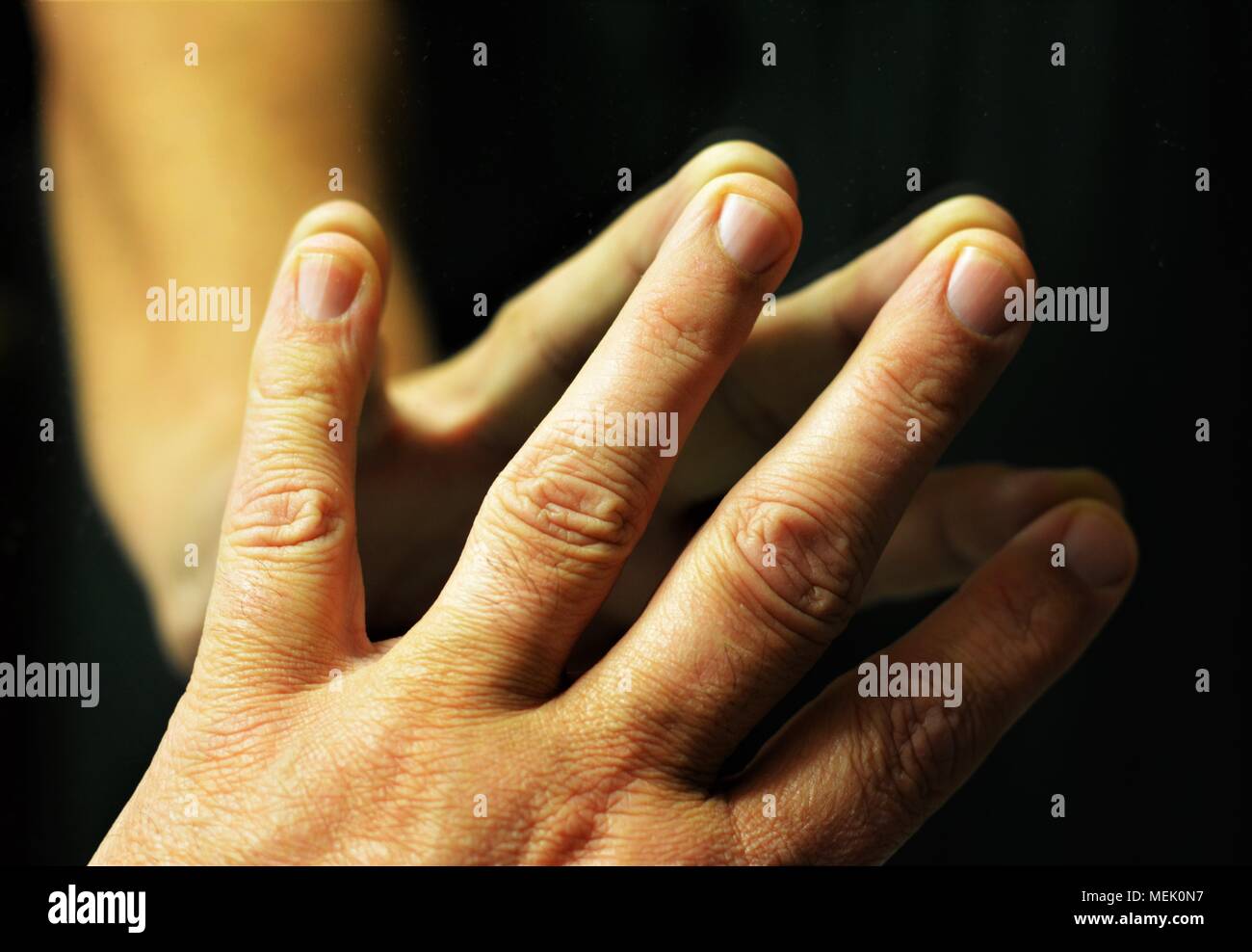 Hand touching mirror hi-res stock photography and images - Alamy
