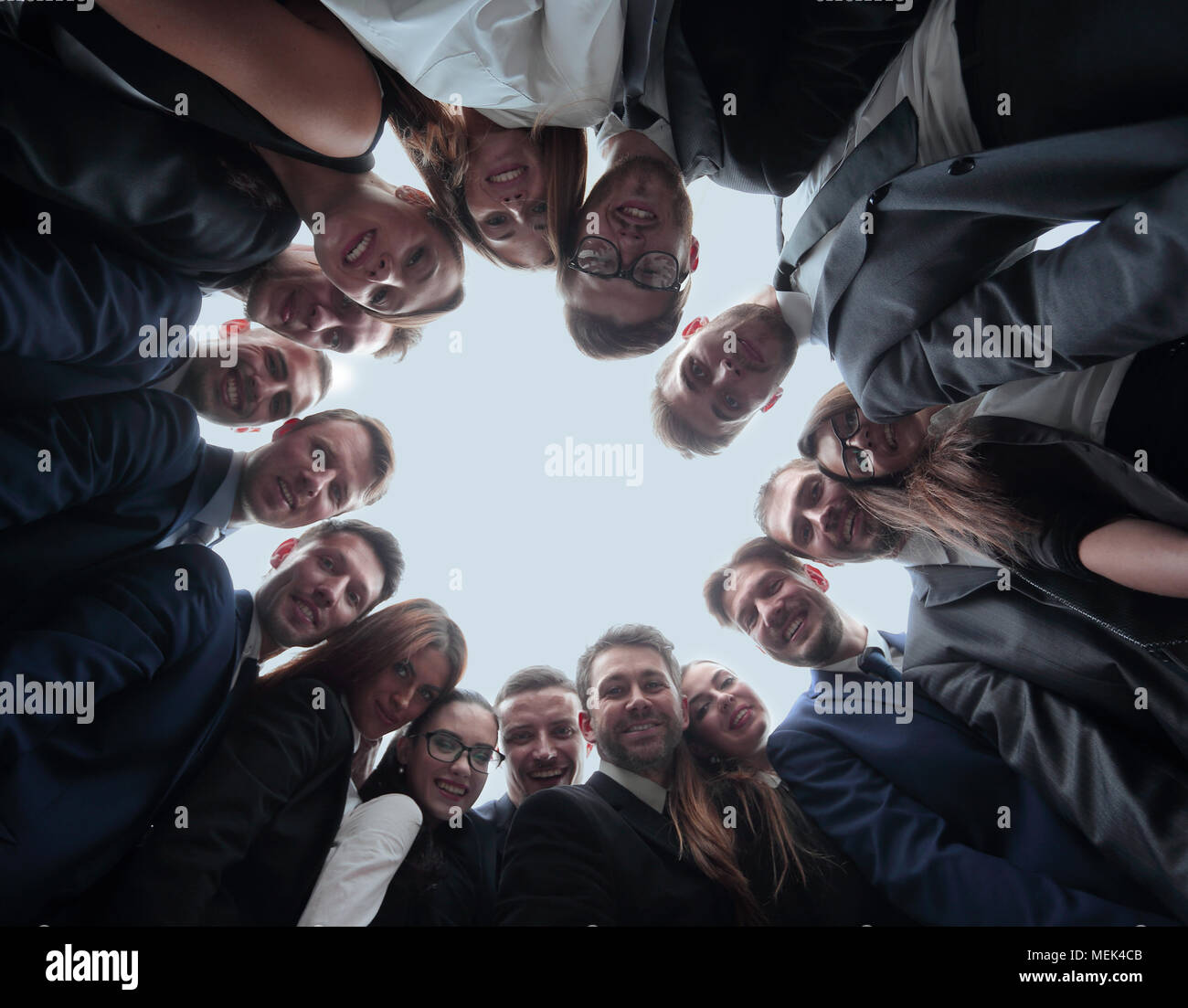 large business team is forming a circle and looking at the camera Stock ...