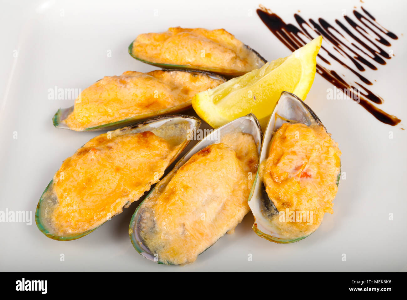 Baked mussels with cheese Stock Photo - Alamy