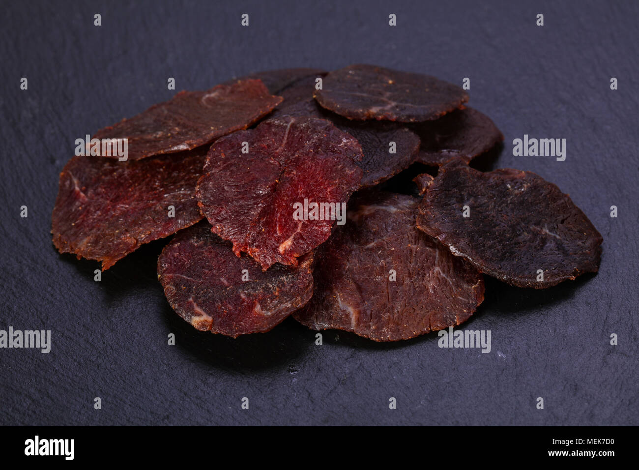 Dry beef meat over wooden Stock Photo - Alamy