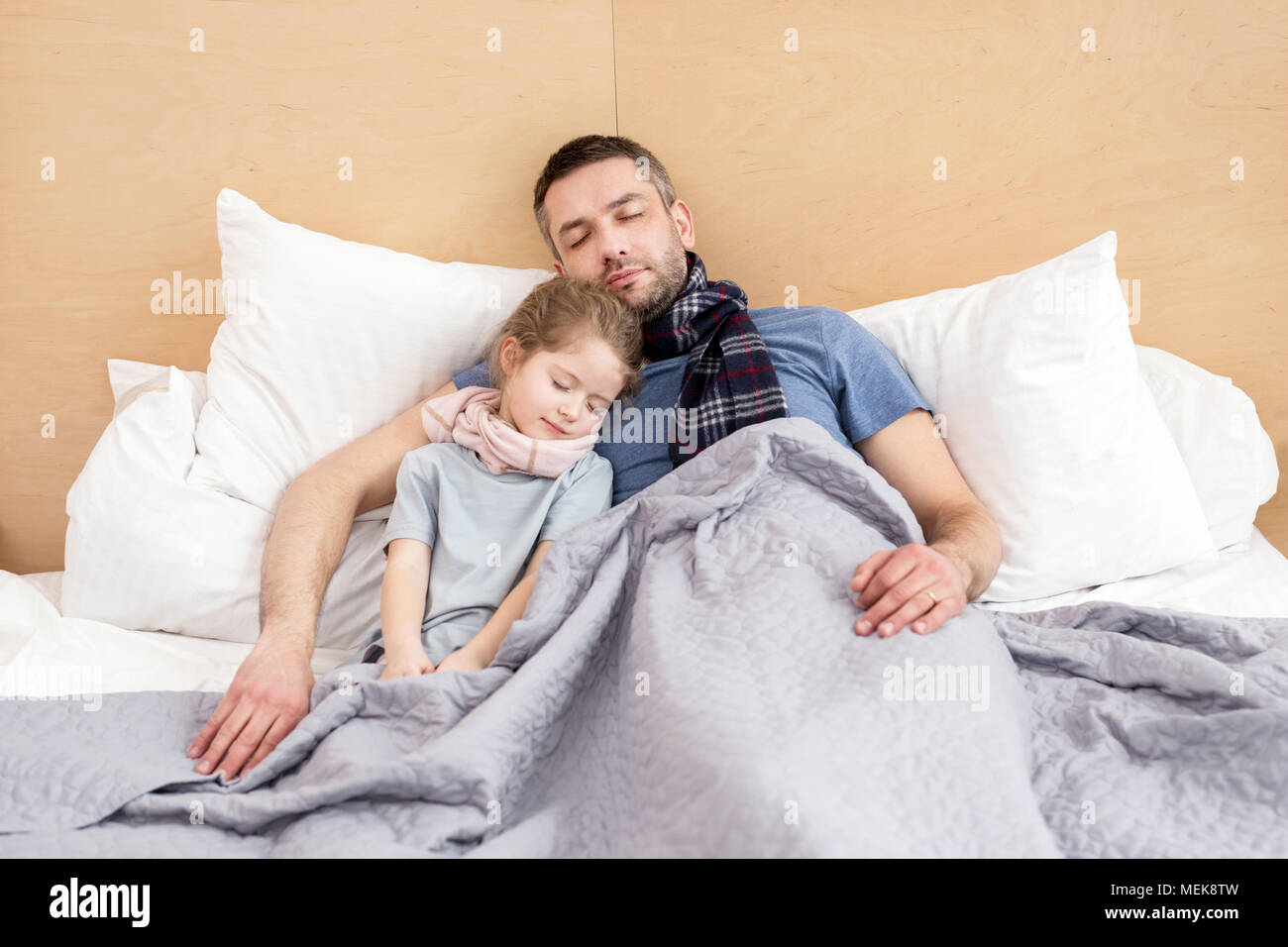 Ill father and daughter sleeping together Stock Photo - Alamy
