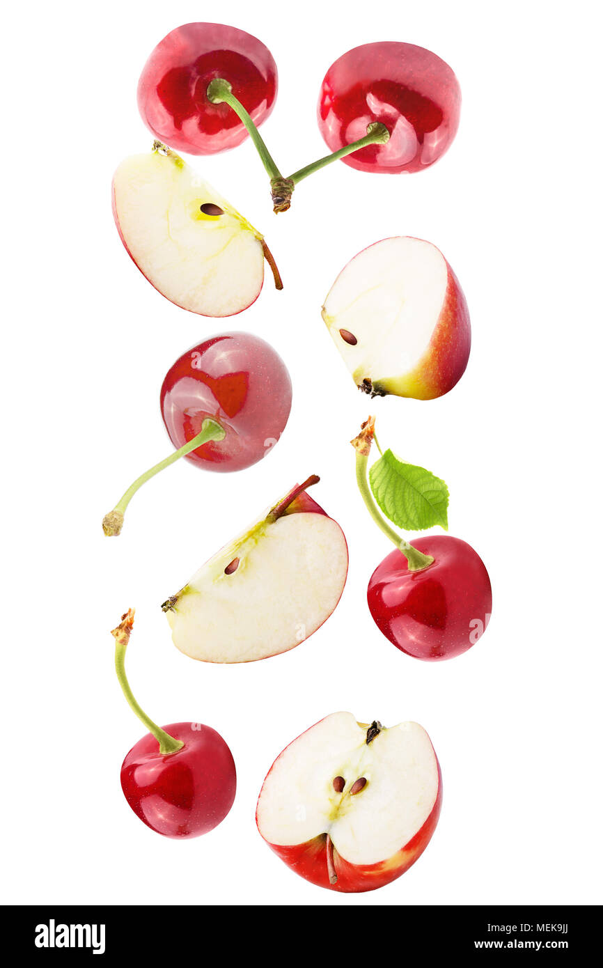 Isolated falling fruits. Falling apple and cherries isolated on white ...