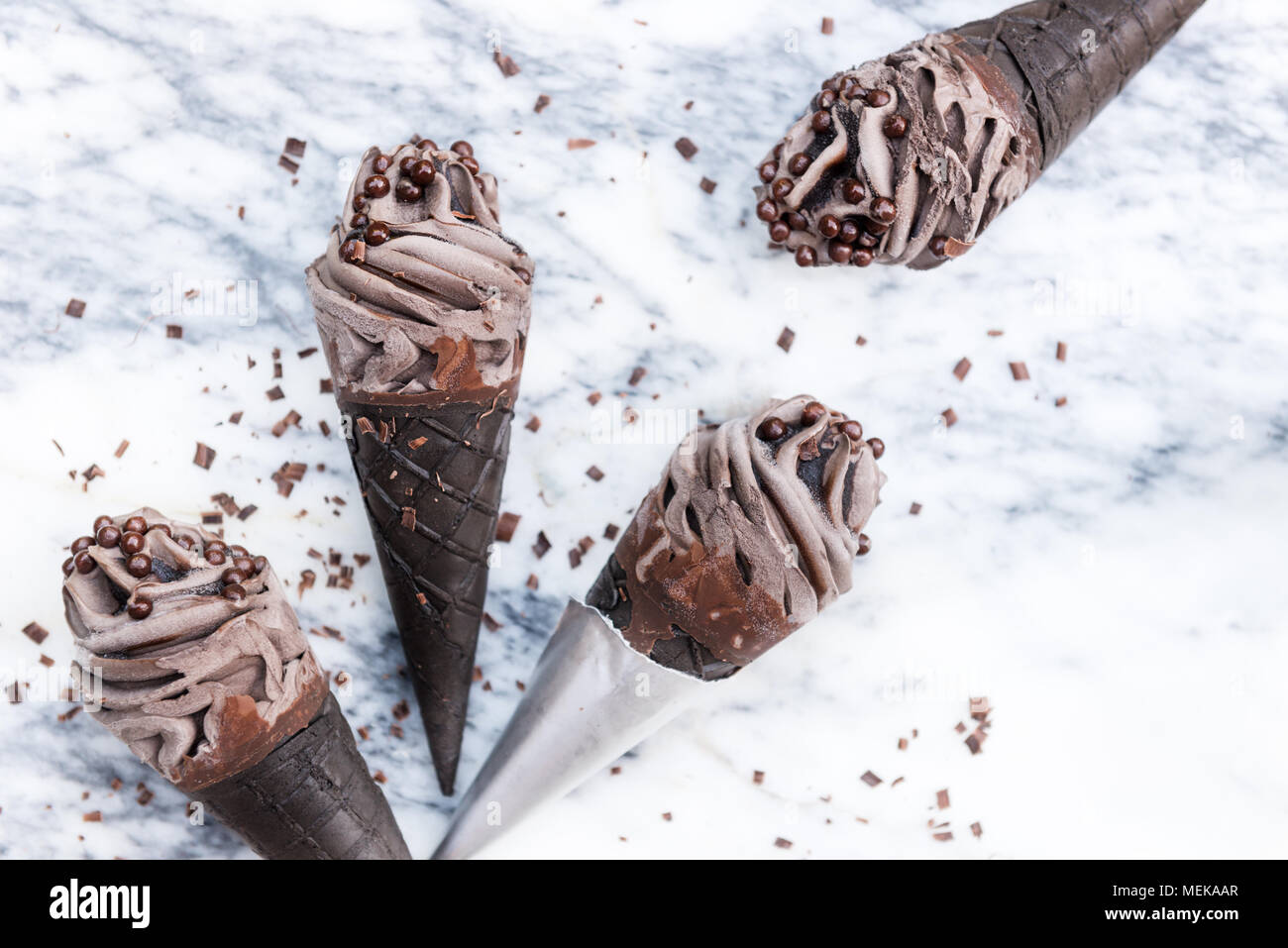 Double Chocolate Ice Creams with Black Waffle Cones on Marble ...