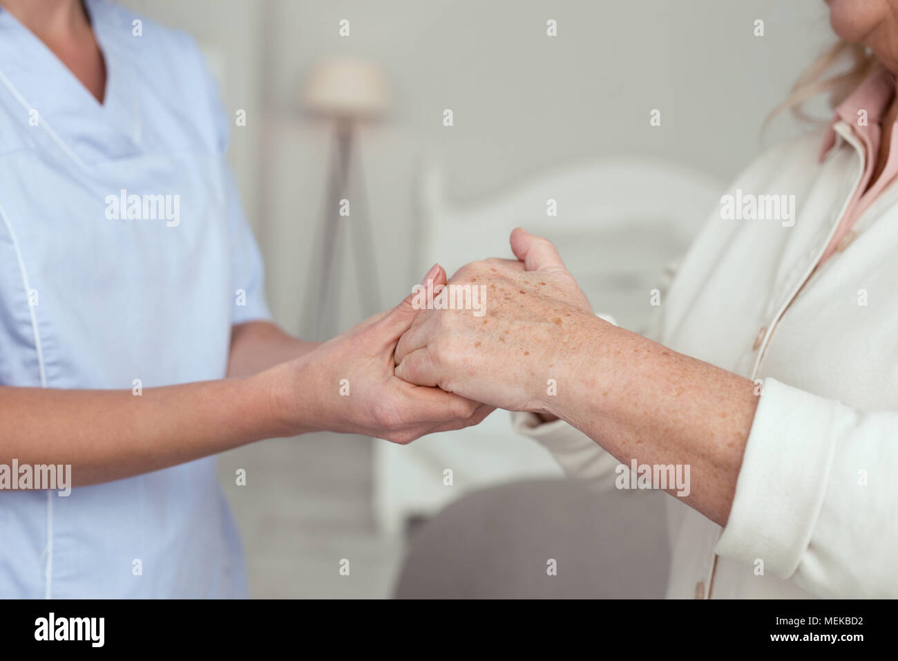 Old woman life support hands hi-res stock photography and images - Alamy