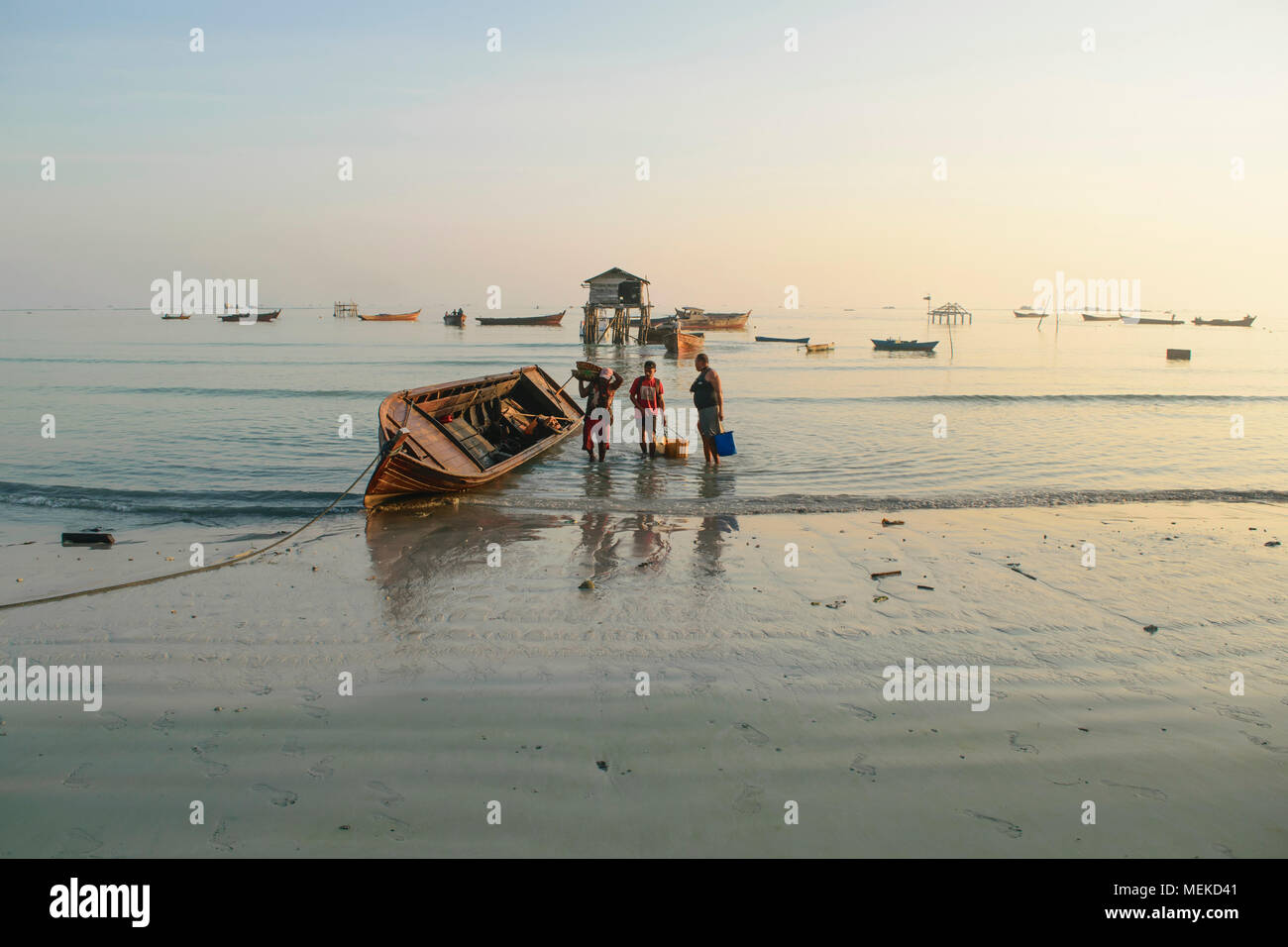 activities of traditional fishermen/fisherman on the beach at morning ...
