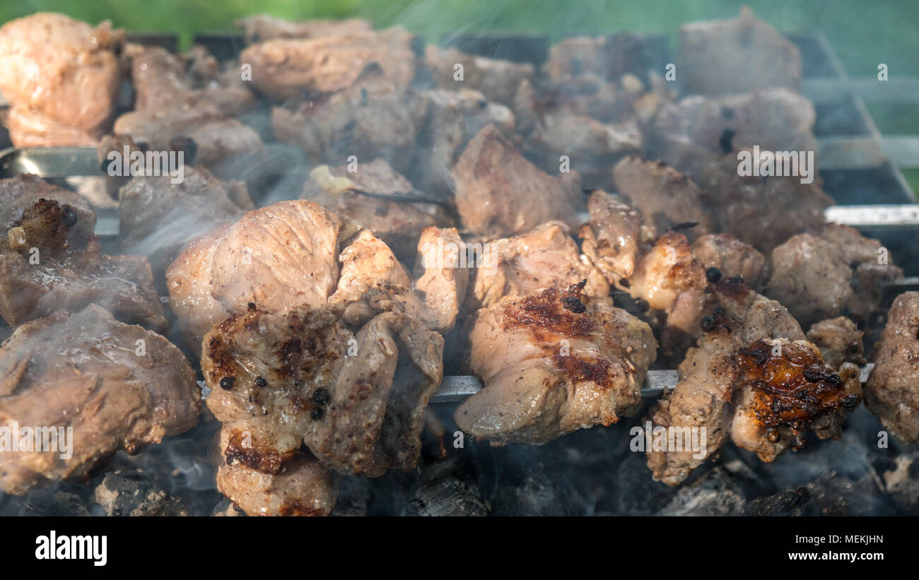Georgian mtsvadi (Shashlik) preparation. Smoking shashlik on the grill ...