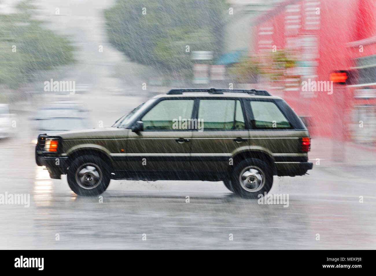 Heavy rainy day moving vehicle Stock Photo - Alamy