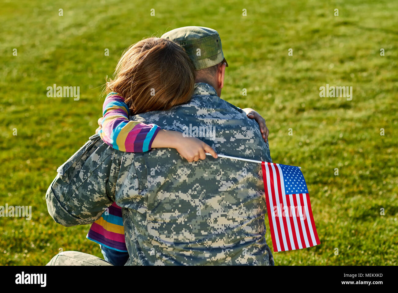 Touching US army soldier reunion with little daughter Stock Photo - Alamy