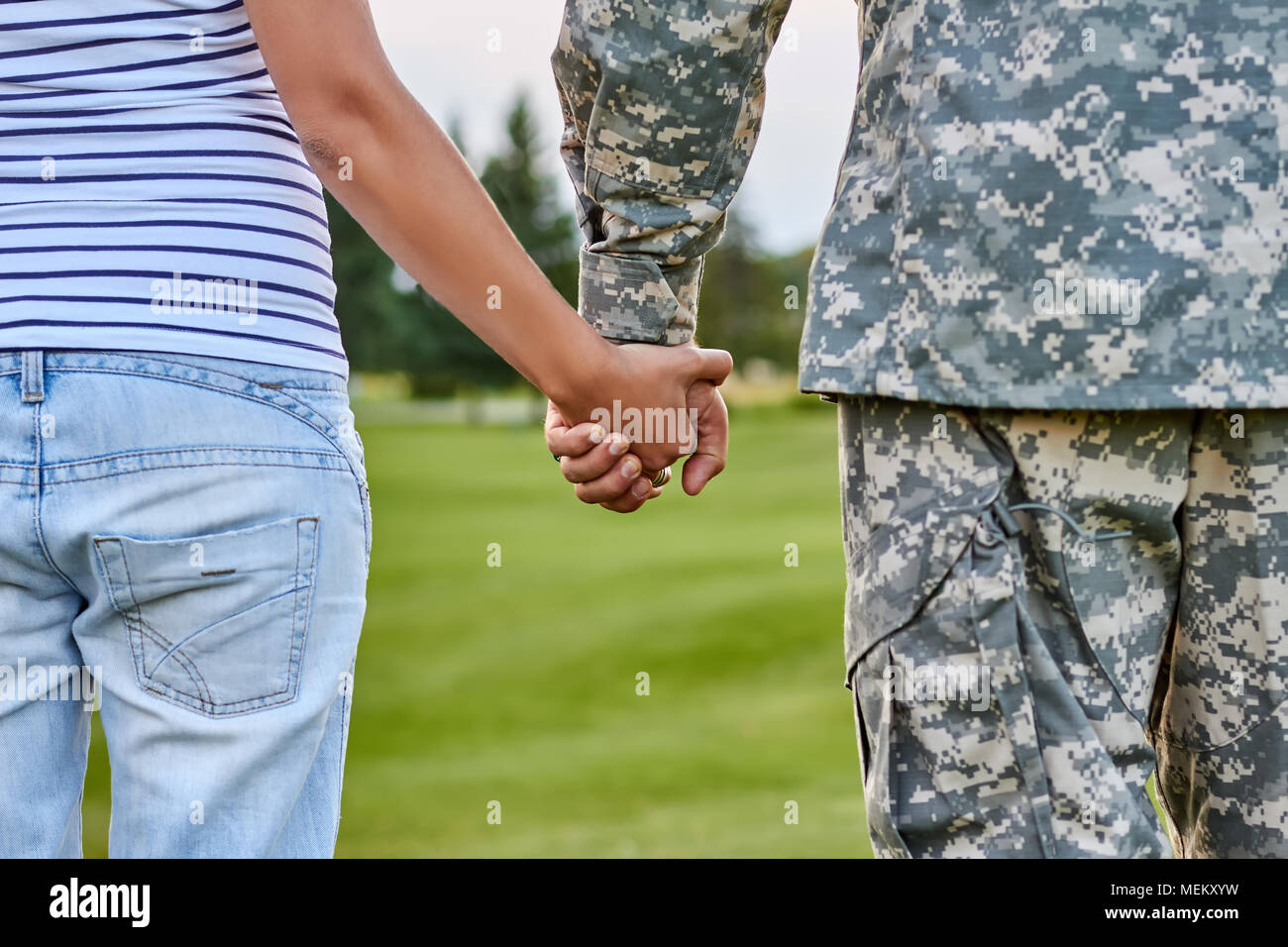 Hands holding, back view Stock Photo - Alamy