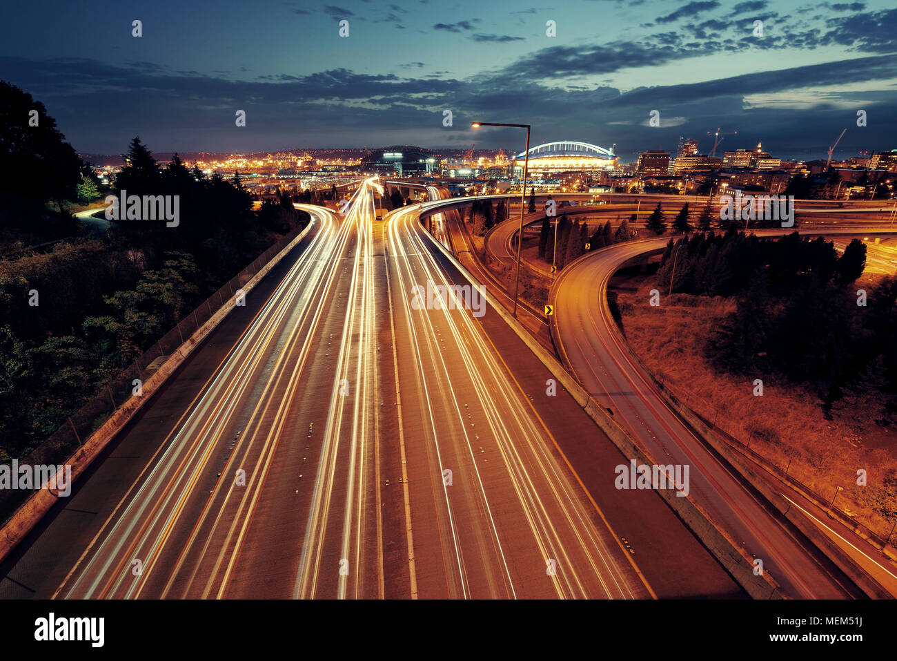 Seattle city view with urban architecture and traffic light trail at ...
