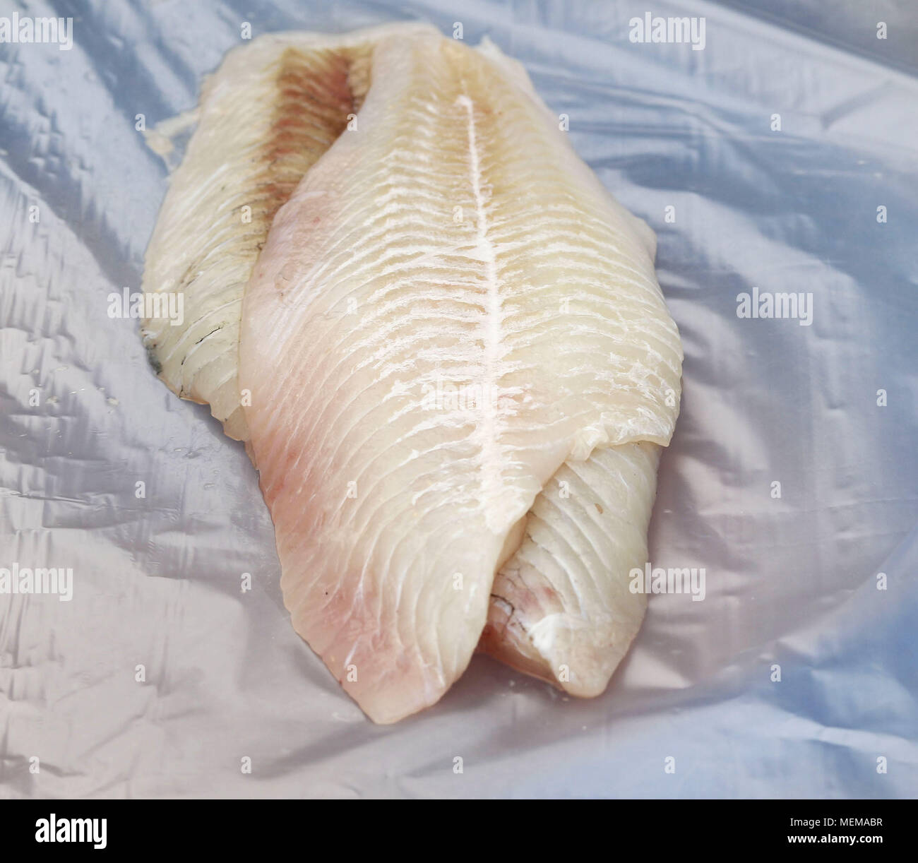 Filet of flounder on wax paper Stock Photo - Alamy