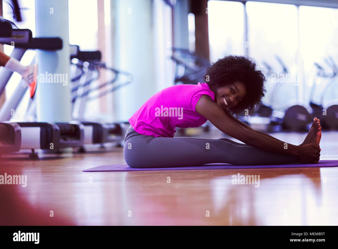 beautiful young african american woman exercise yoga in gym Stock Photo ...