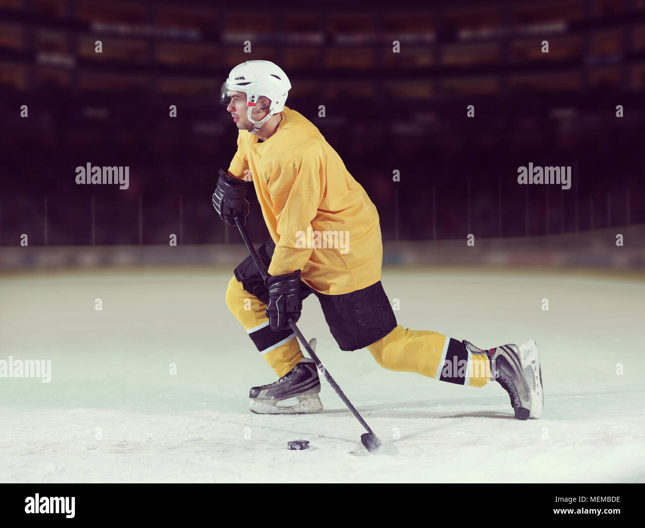 ice hockey player in action kicking with stick Stock Photo - Alamy